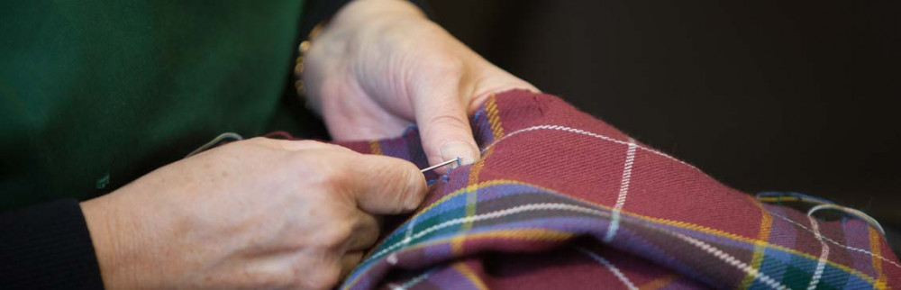 Weaving tartan: inspection and hand-darning | CLAN